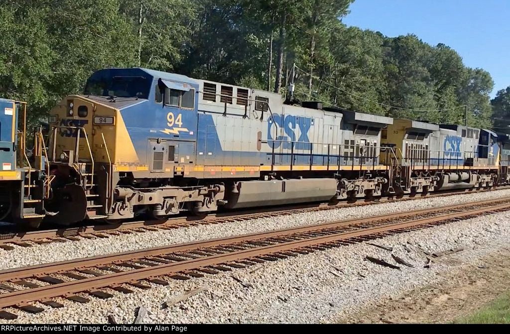 CSX AC44CW 94 runs third in a set of 5 units rolling mixed freight SB